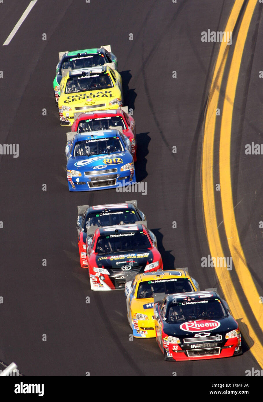 Clint Bowyer leads the field through the tri-oval during the NASCAR ...