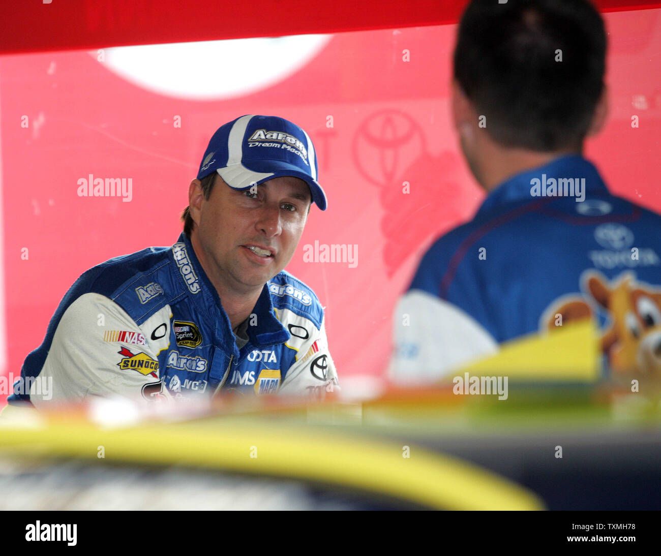 David Reutimann waits in his garage for Coke Zero 400 practice to begin ...