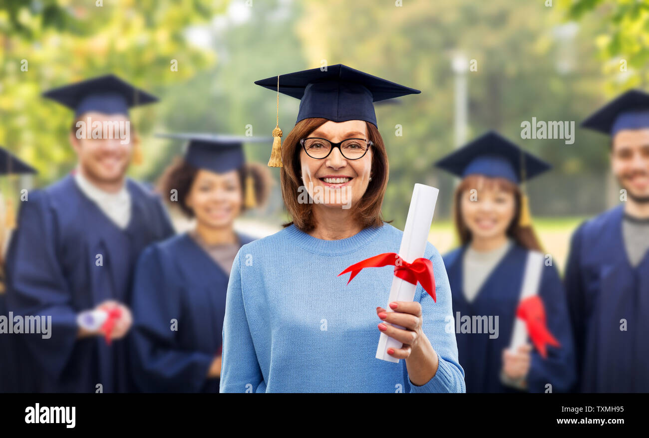 happy senior graduate student woman with diploma Stock Photo - Alamy