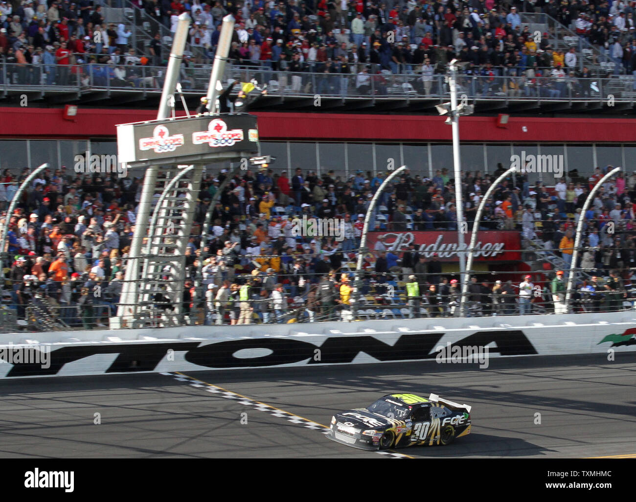 James Buescher takes the checkered flag for the win in the NASCAR ...