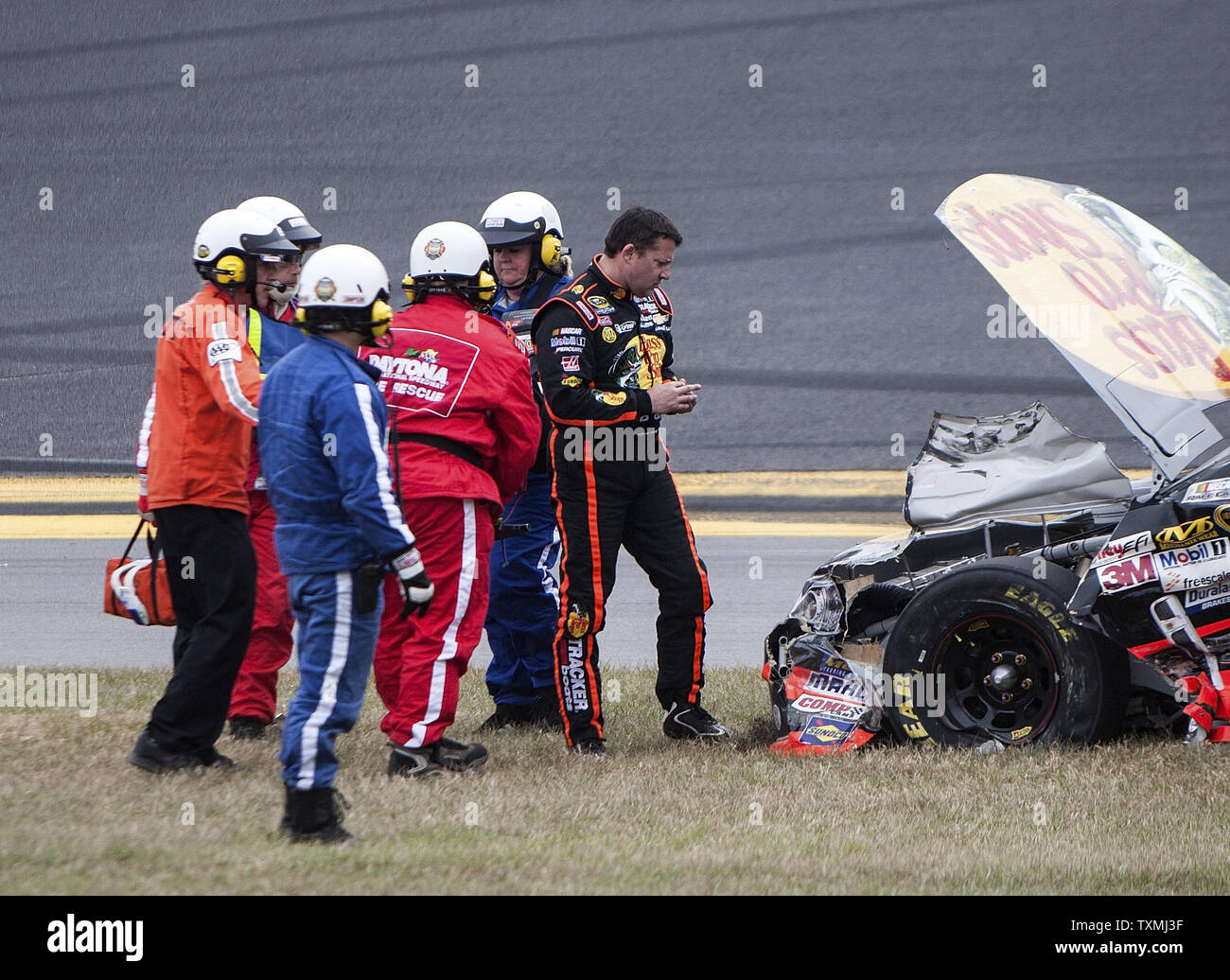 Tony Stewart Looks Over His Bass Pro Shops Mobil 1 Chevrolet After