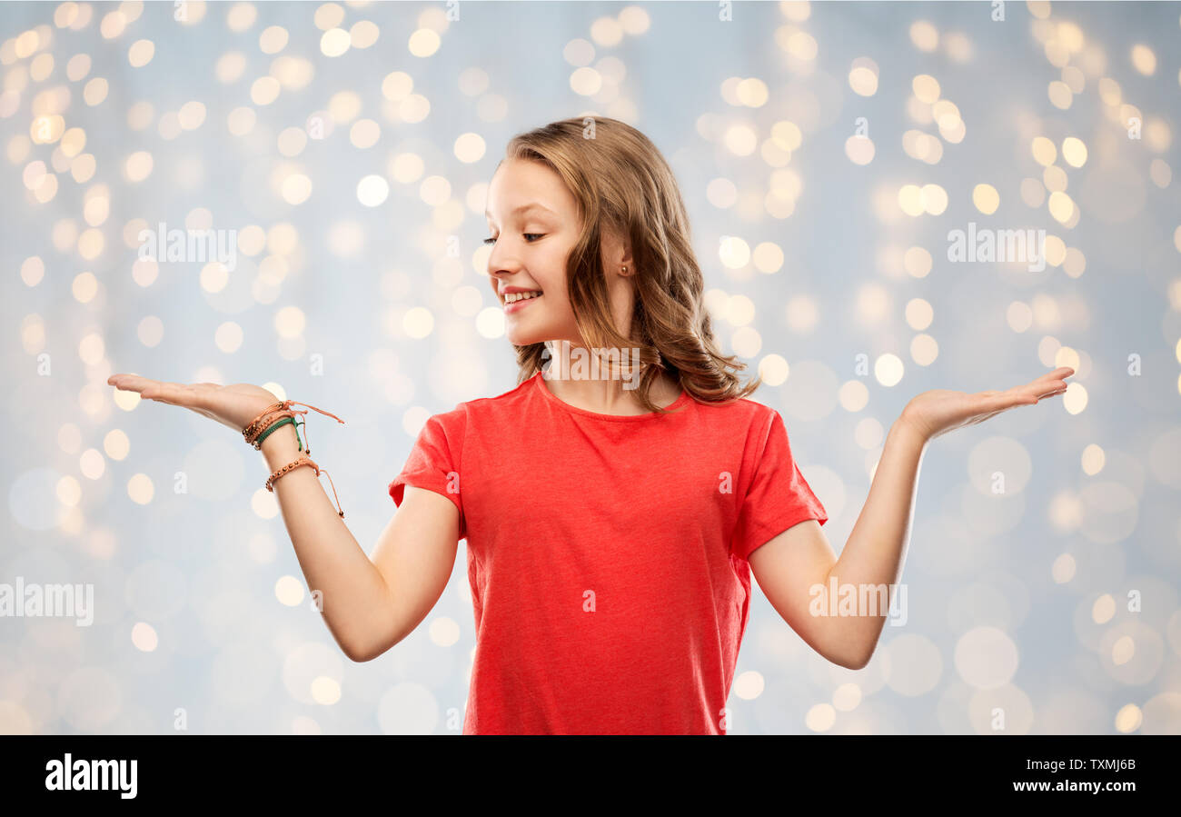 smiling teenage girl holding empty hand Stock Photo - Alamy