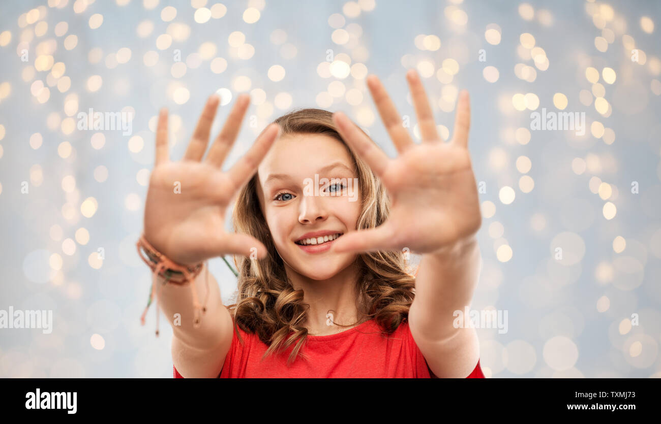 happy teenage girl in red t-shirt giving high five Stock Photo - Alamy