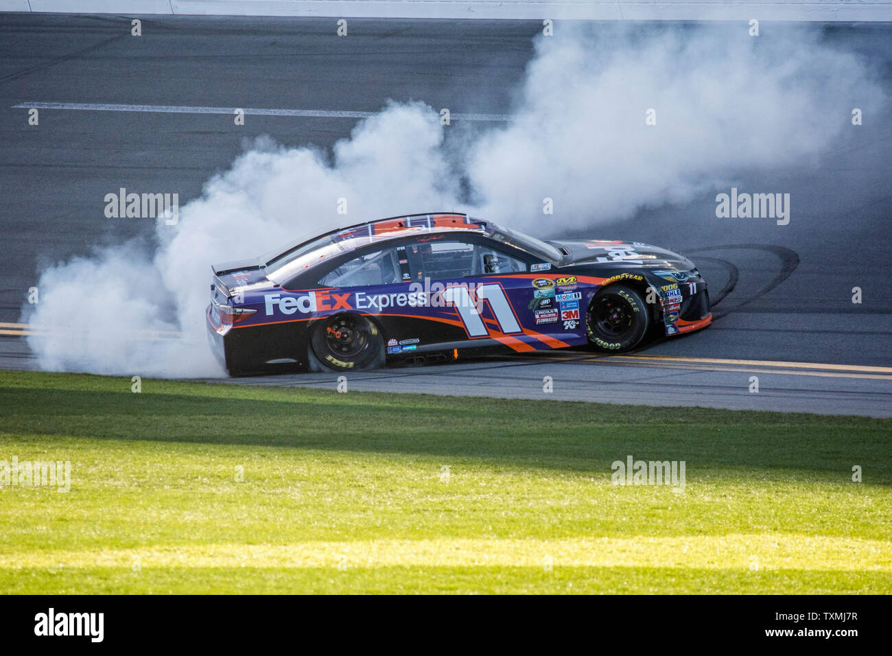 Denny Hamlin does a burn out celebrating his first Daytona 500 win at ...