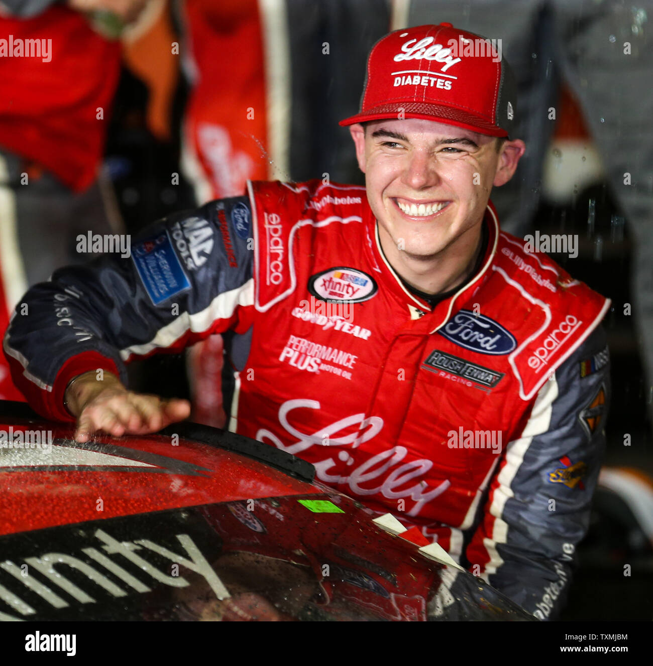 Ryan Reed celebrates in Victory Lane winning the Powershares QQQ 300 at ...