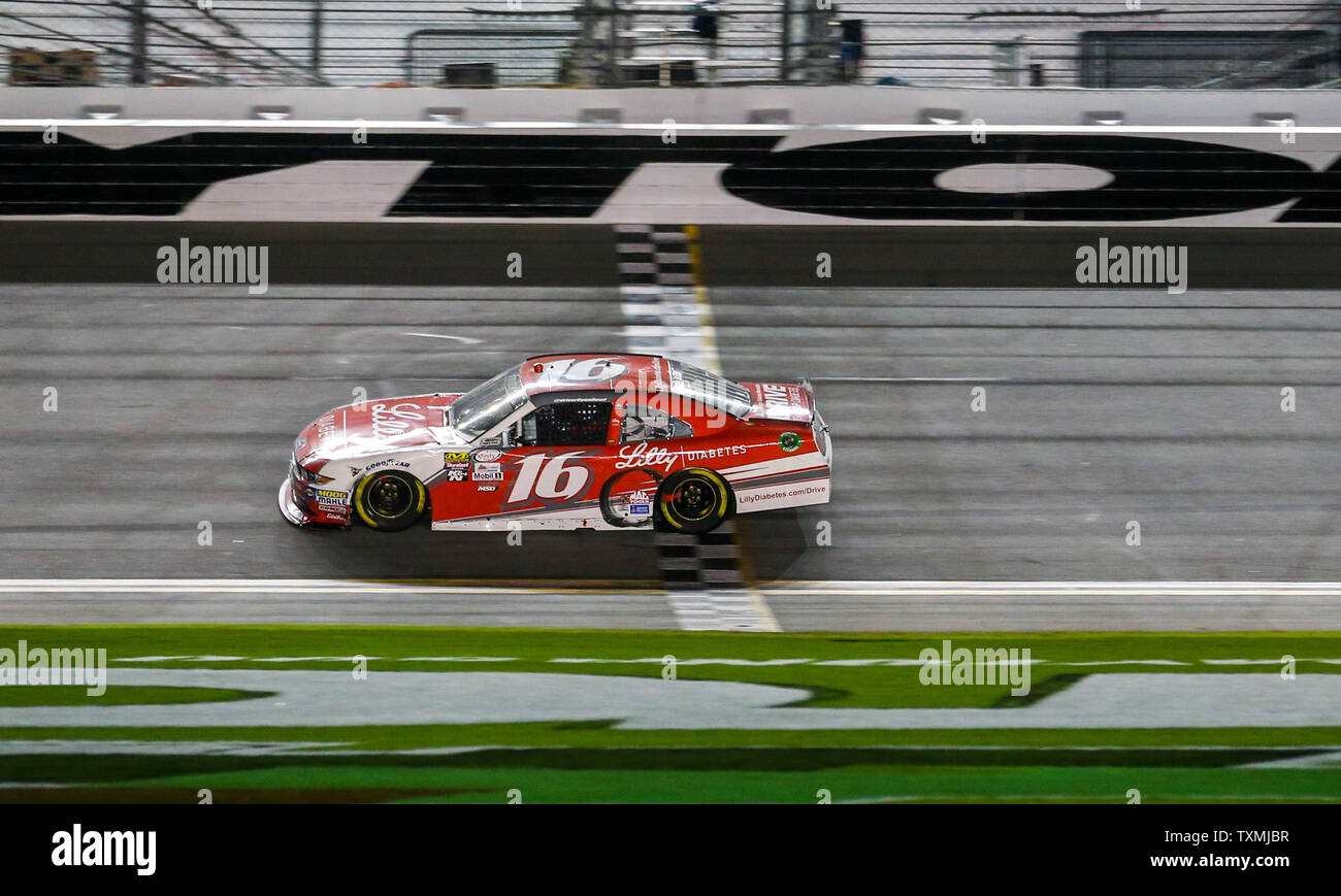 Ryan Reed crosses the finish line winning the Powershares QQQ 300 at ...