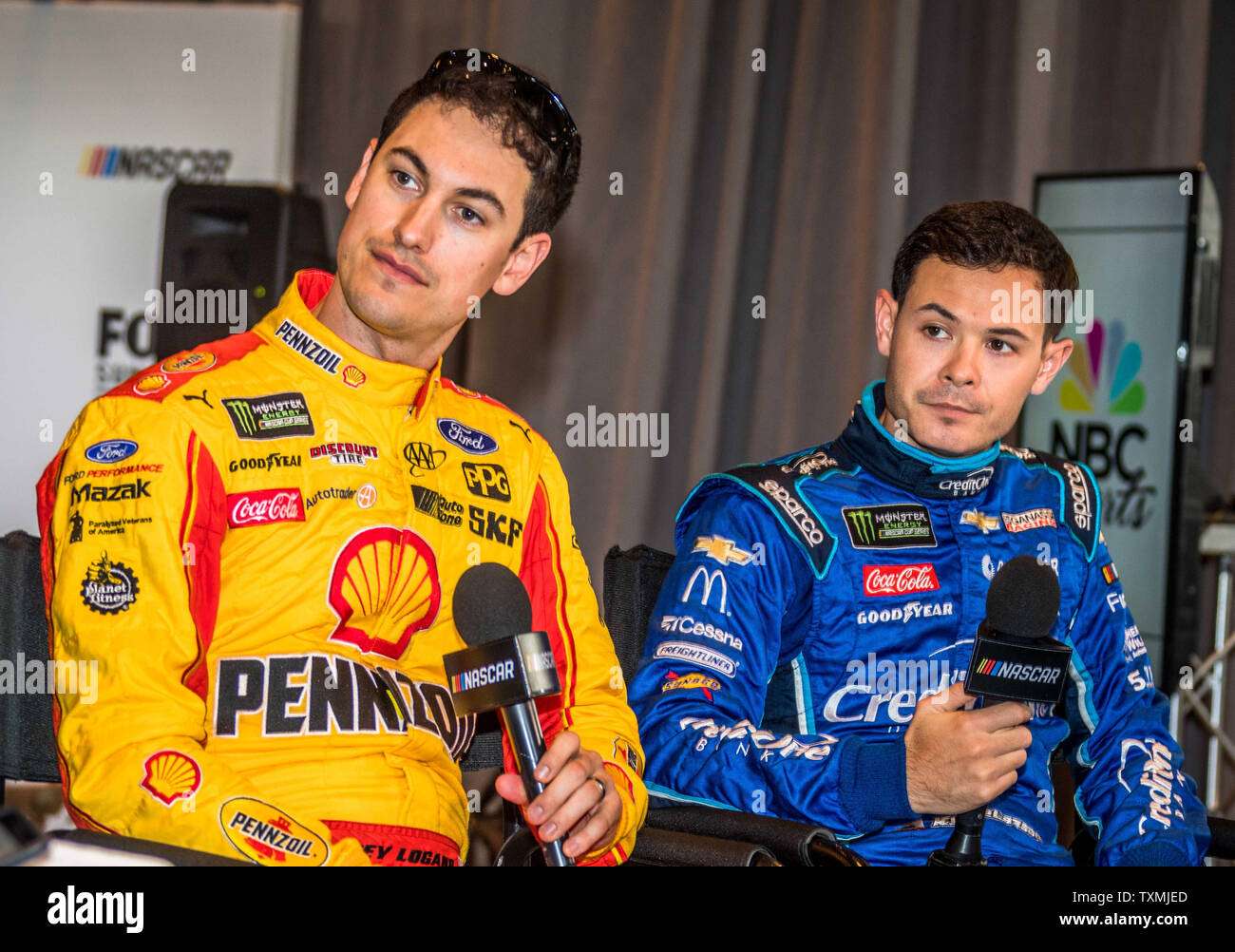 Joey Logano (left) and Kyle Larson answer questions as part of Media ...