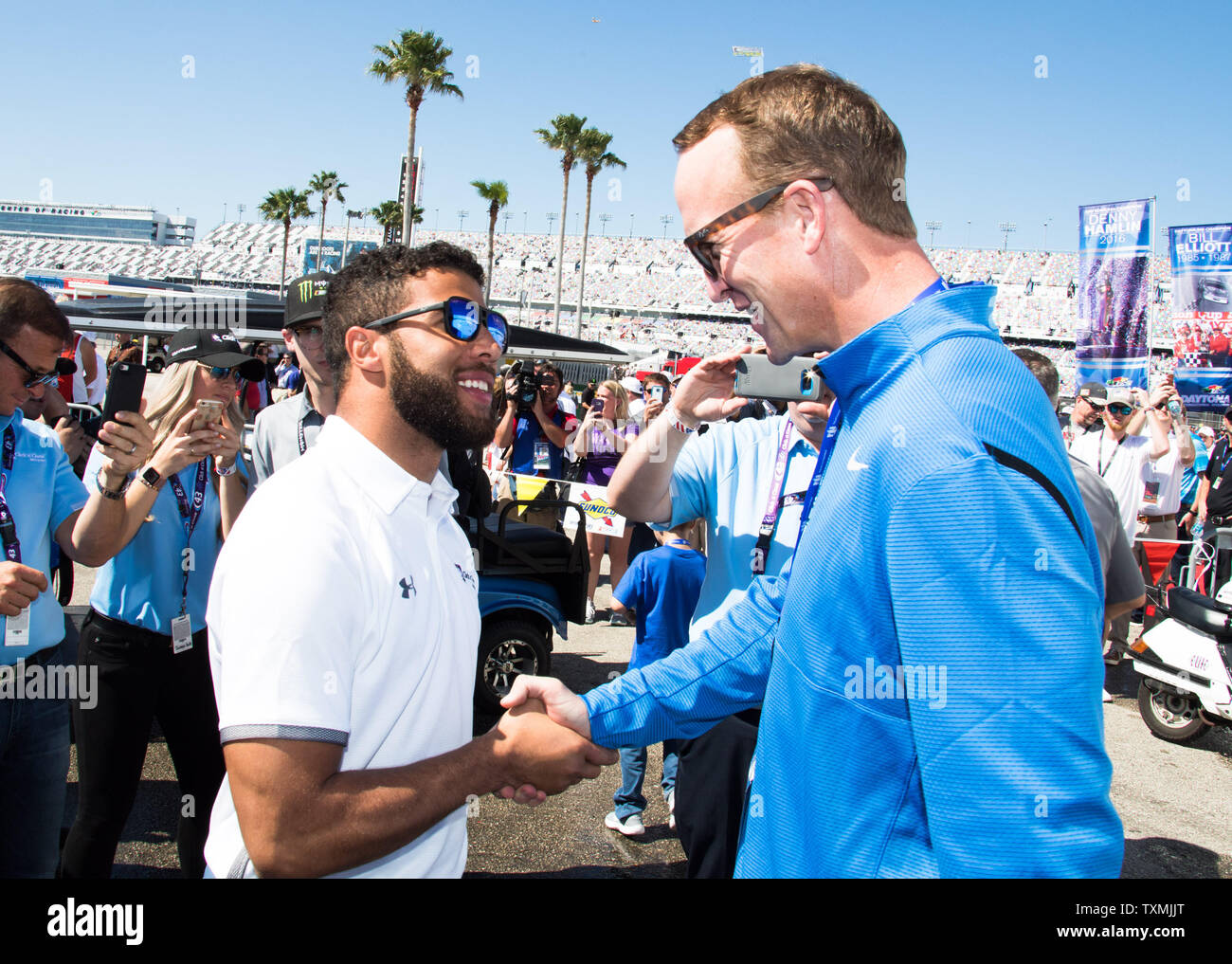Darrell Wallace Jr. (left) and Peyton Manning chat prior to the 2018 ...