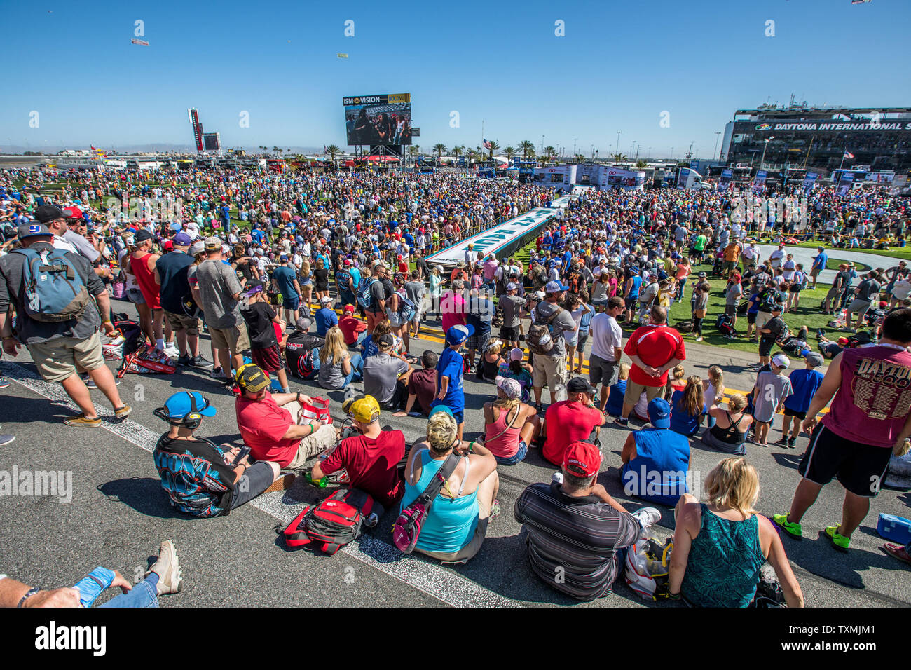 Fans crowd the grassy trioval around the runway prior to the 60th ...