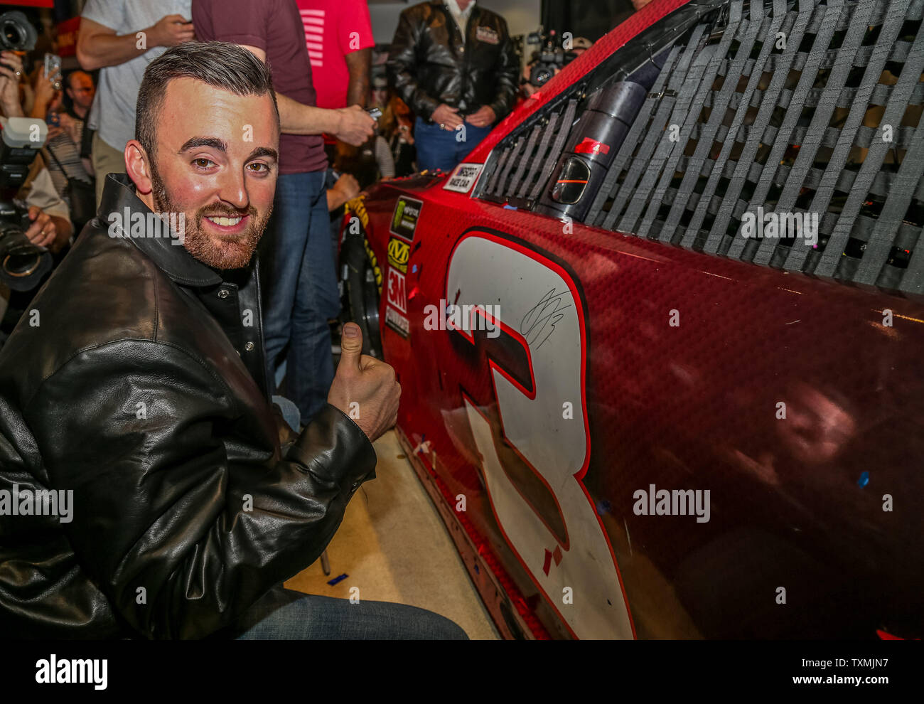 Austin Dillon, winner of the 60th Daytona 500, autographs his winning ...