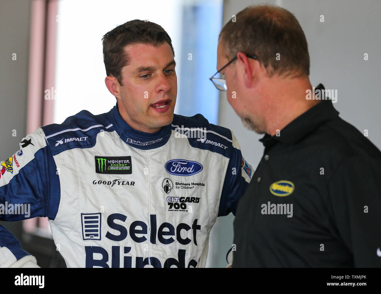 David Ragan (38) gives car feedback to a crew member during practice ...
