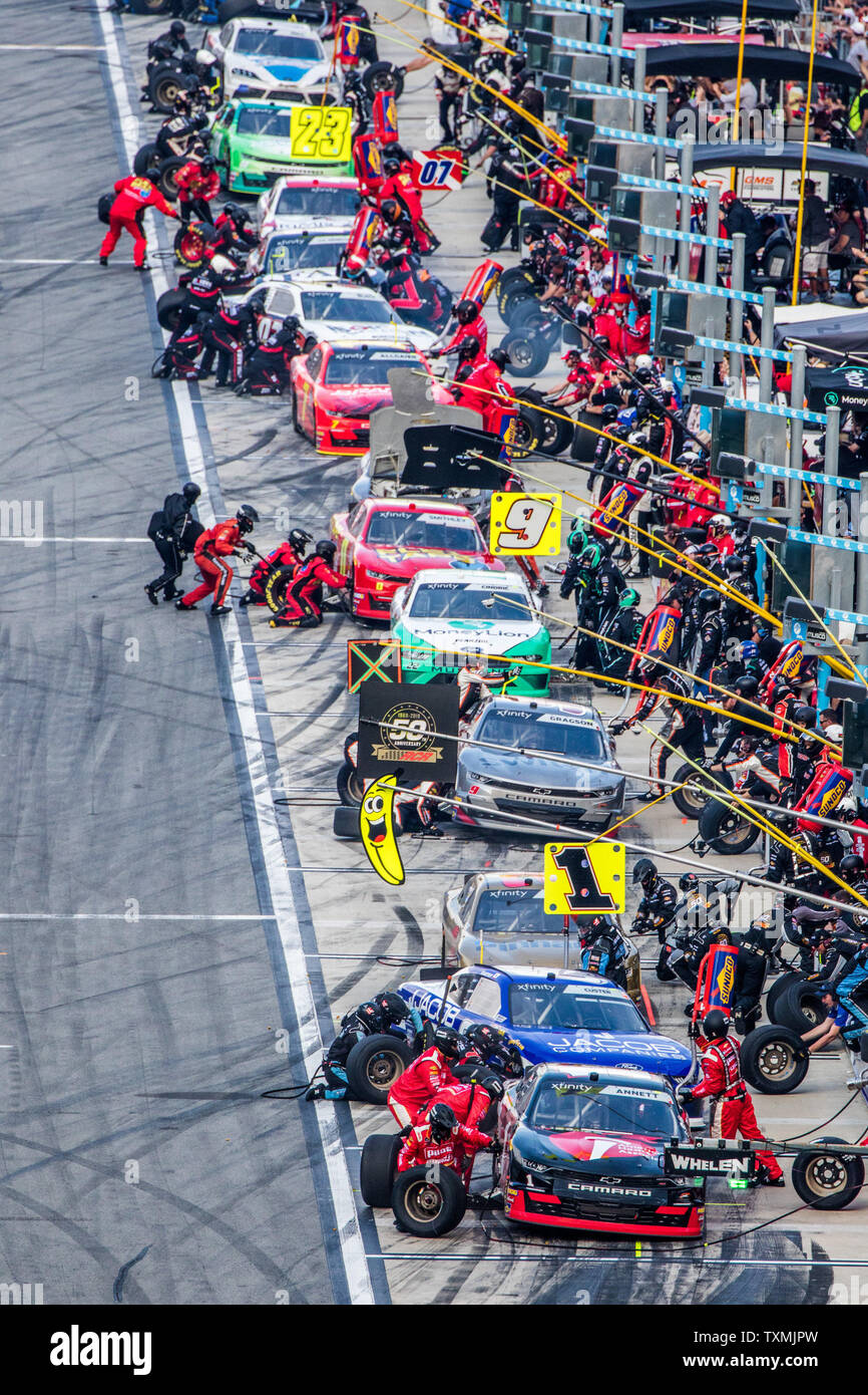 Eventual winner Michael Annett (front) pits with the field at the end ...