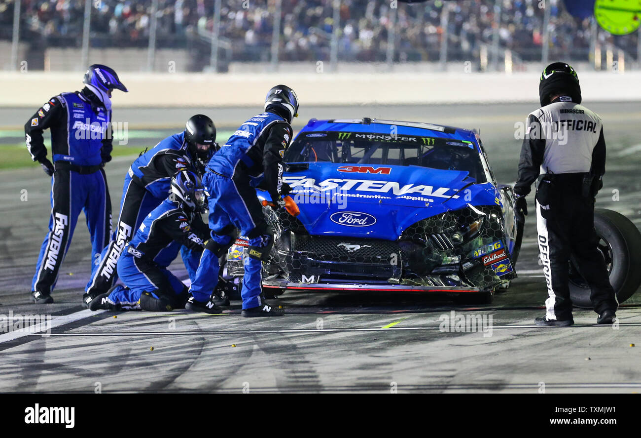The team works on repairing the number 17 Fastenal Ford of Ricky ...