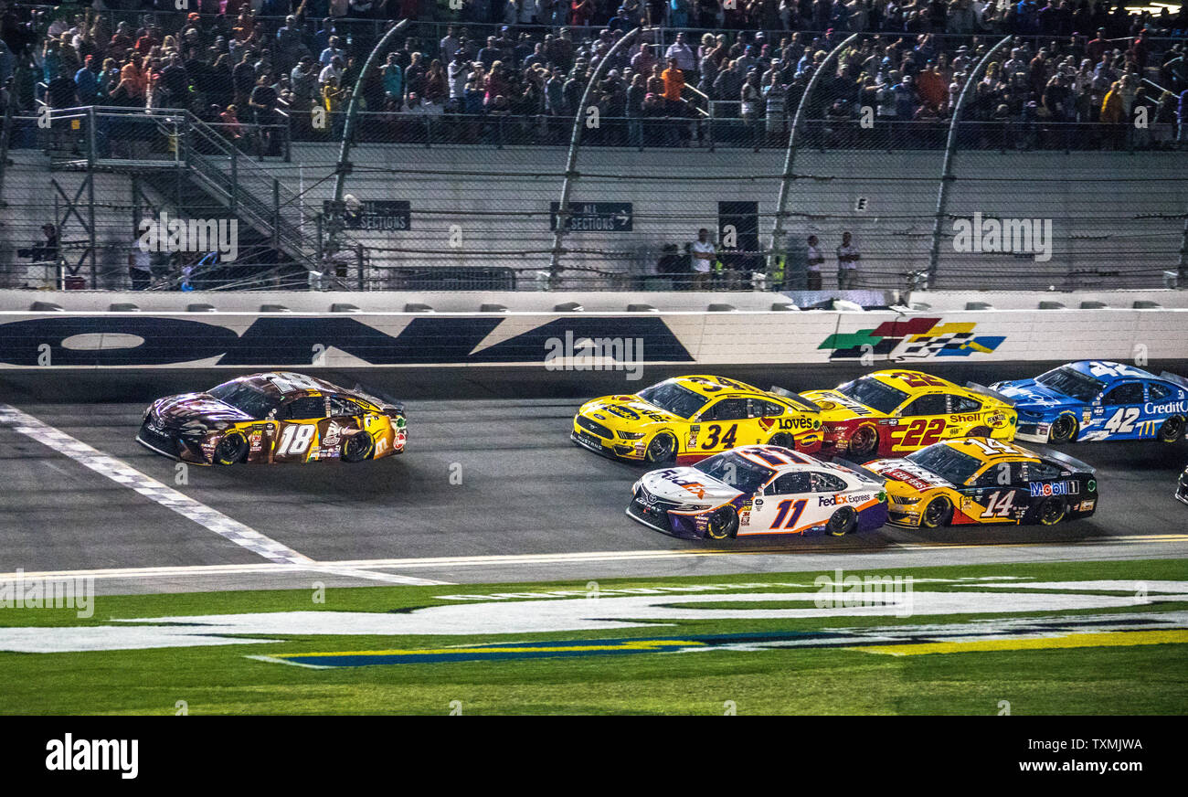 Kyle Busch (18) leads Denny Hamlin (11) prior to a series of accidents ...