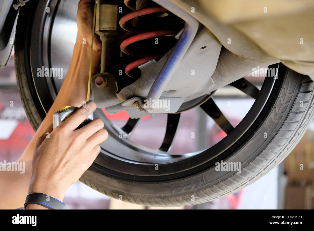 mechanic checking the car condition Stock Photo - Alamy