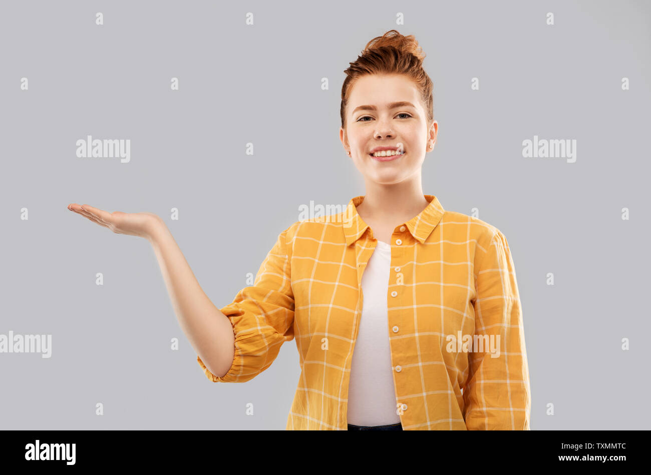 red haired teenage girl holding empty hands Stock Photo - Alamy