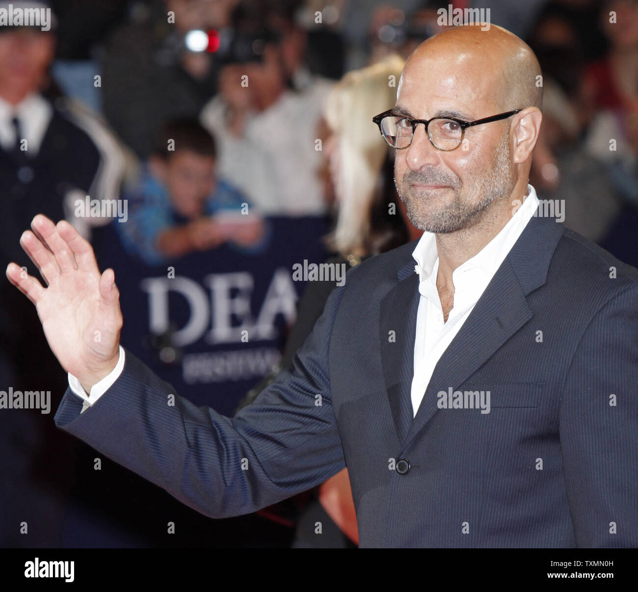 Actor Stanley Tucci arrives on the red carpet before a screening of the ...