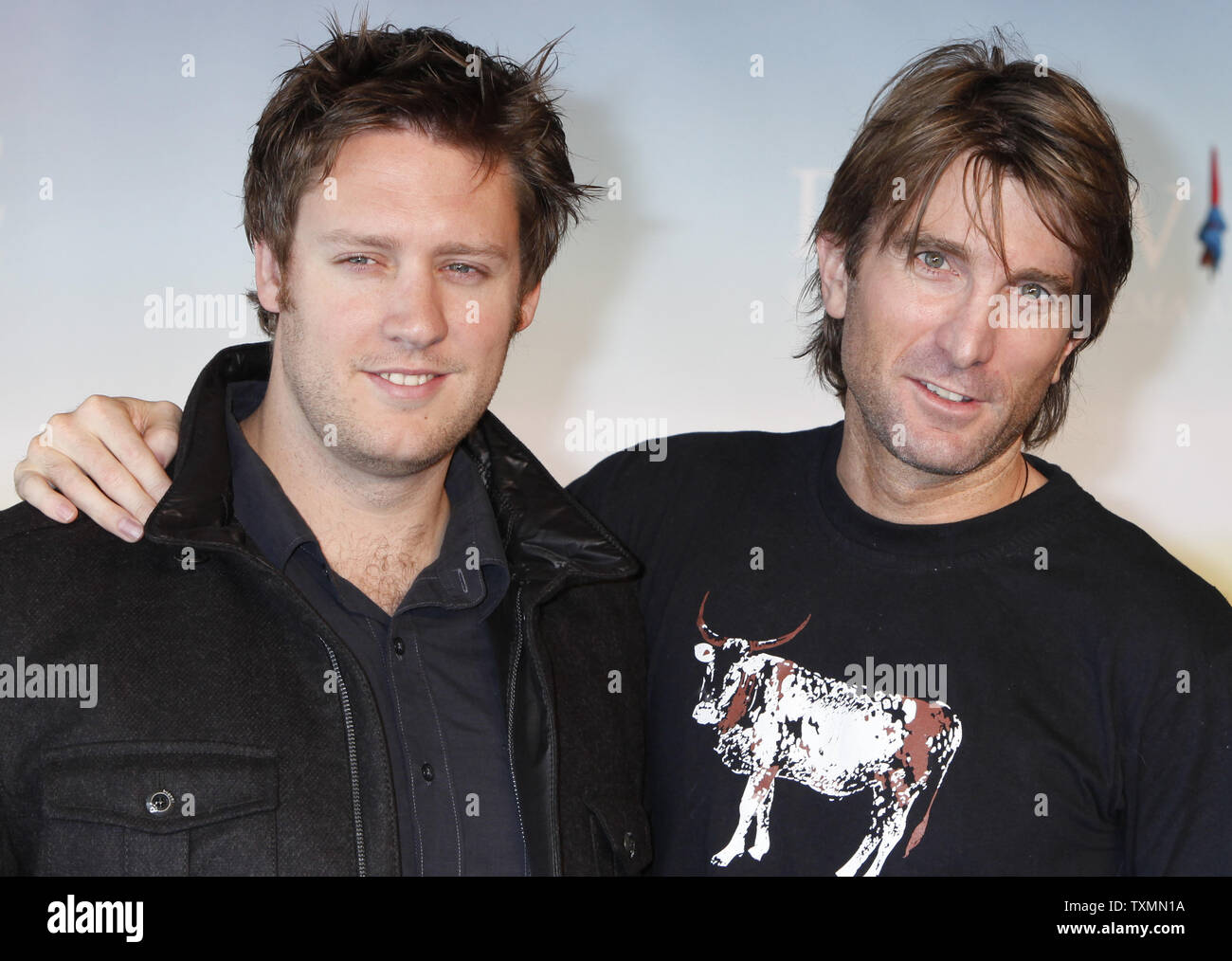 Director Neill Blomkamp (L) and actor Sharlto Copley arrive at a ...