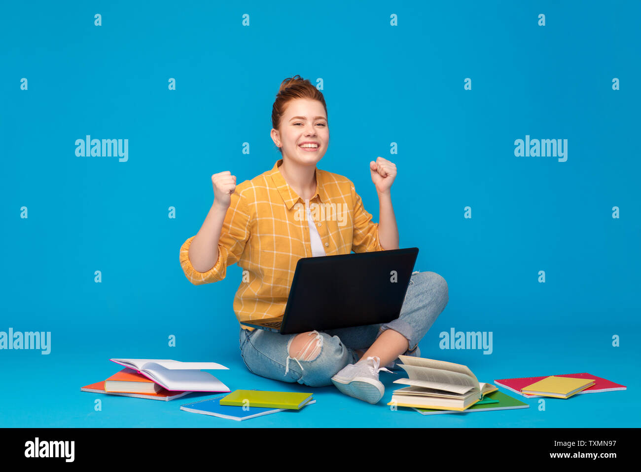 happy student girl with laptop celebrating success Stock Photo - Alamy