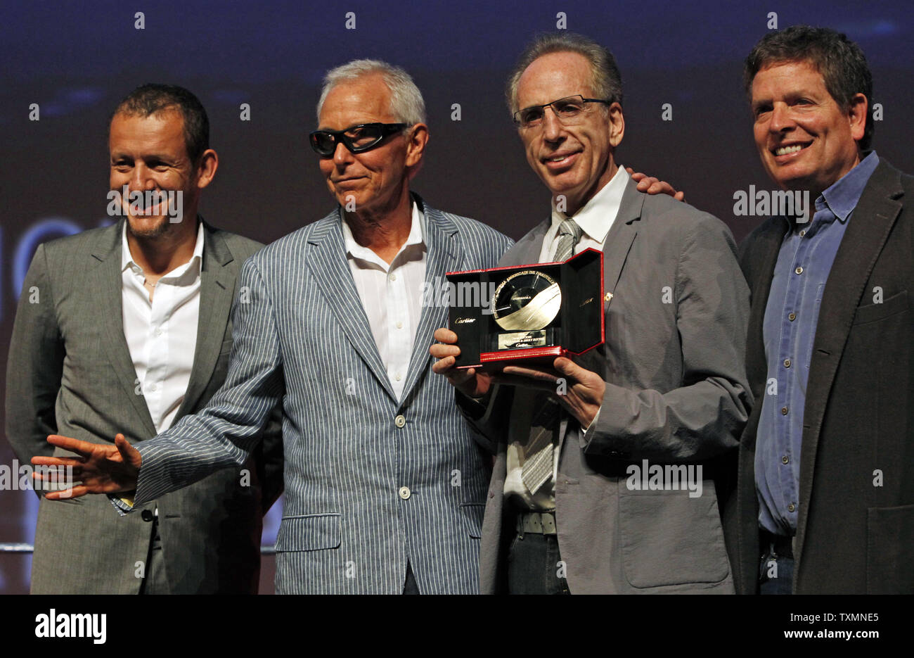 (From L to R) Actor Dany Boon presents Jim Abrahams, Jerry Zucker and ...