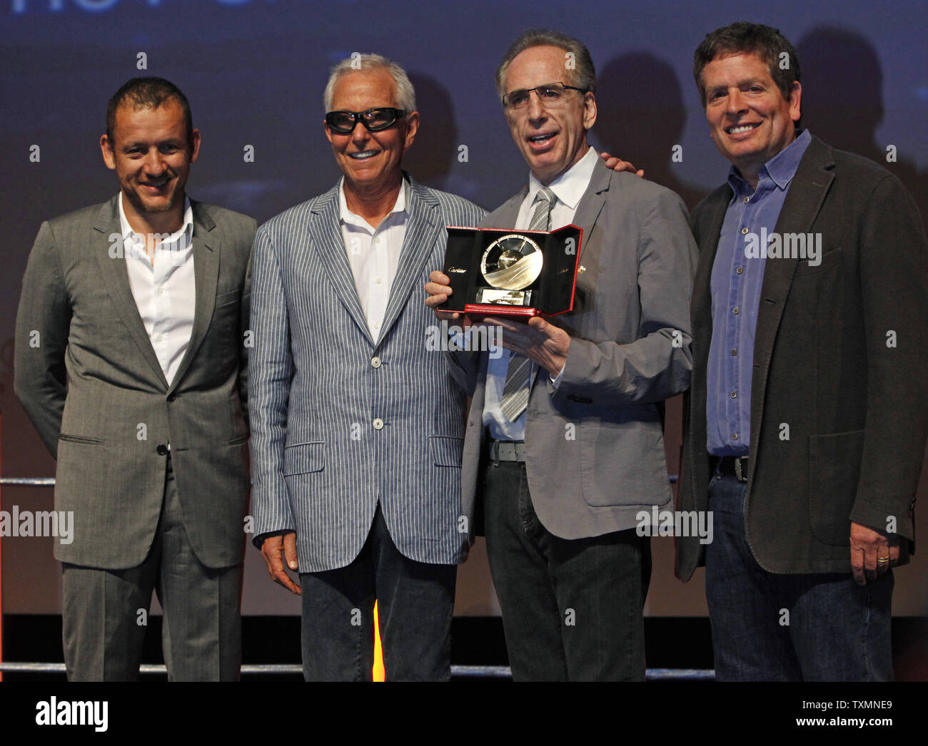 (From L to R) Actor Dany Boon presents Jim Abrahams, Jerry Zucker and ...