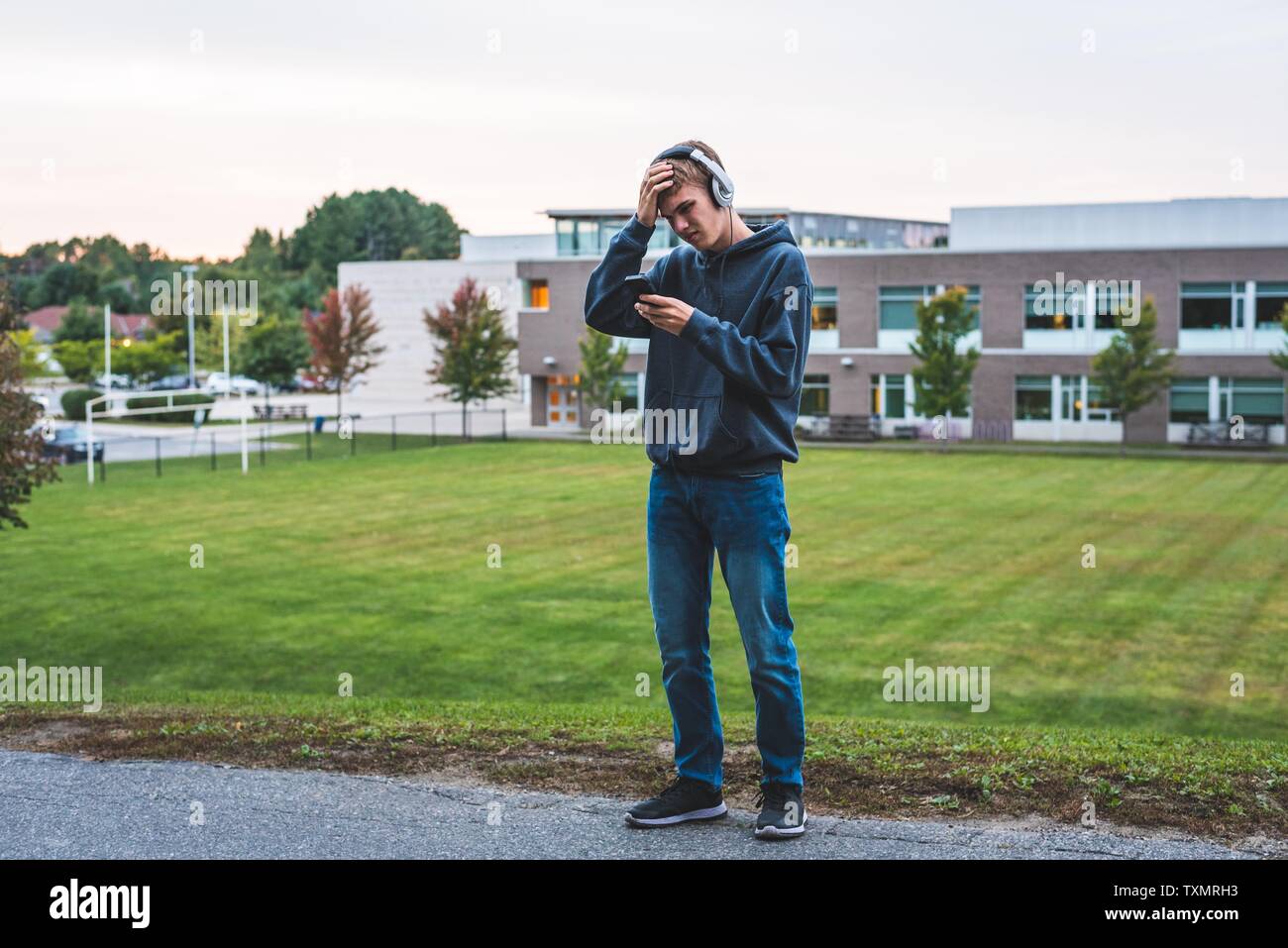 Boy on phone crying hi-res stock photography and images - Alamy