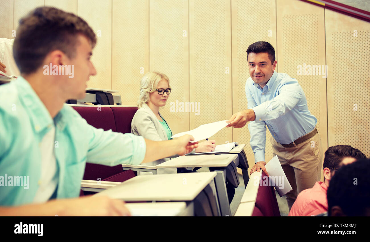 teacher giving tests to students at lecture Stock Photo - Alamy