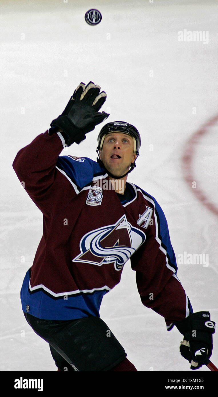 Colorado Avalanche defenseman Rob Blake eyes a flying puck against the ...