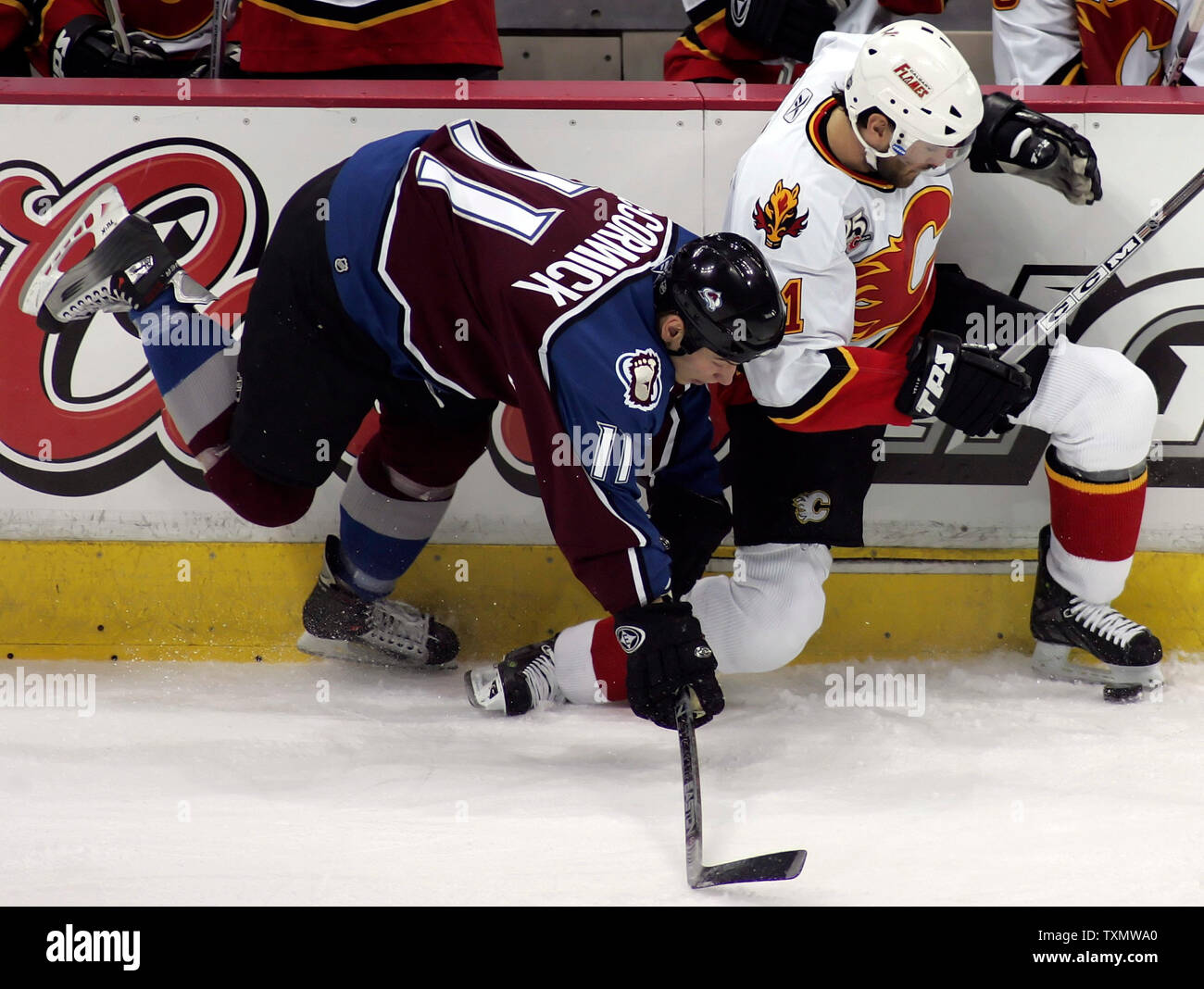 Colorado Avalanche center Cody McCormick (L) battles Calgary Flames ...