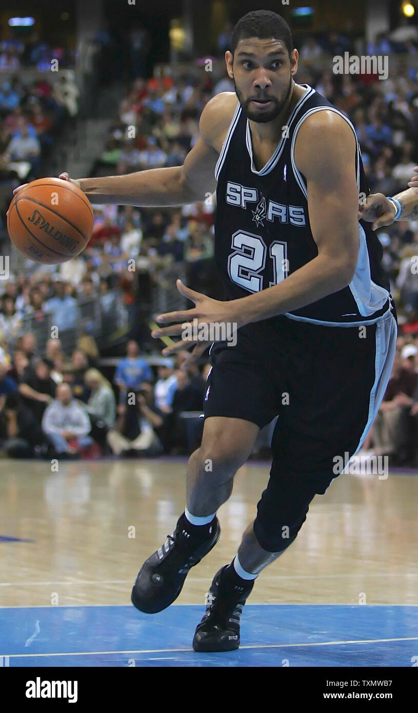 San Antonio Spurs forward Tim Duncan drives against the Denver Nuggets ...