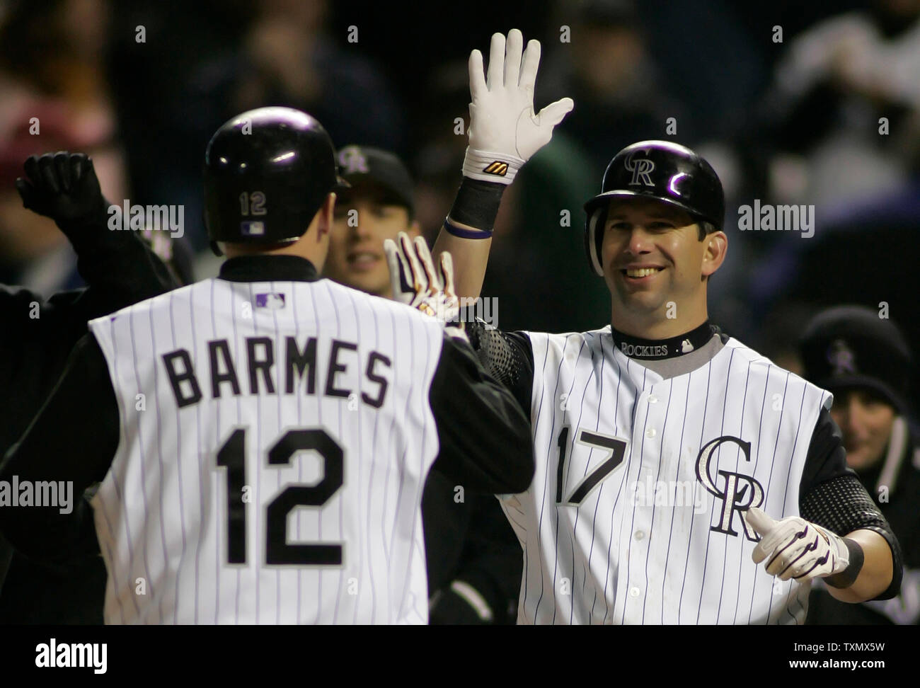 Colorado Rockies Todd Helton (R) congratulates teammate Clint Barmes (L ...