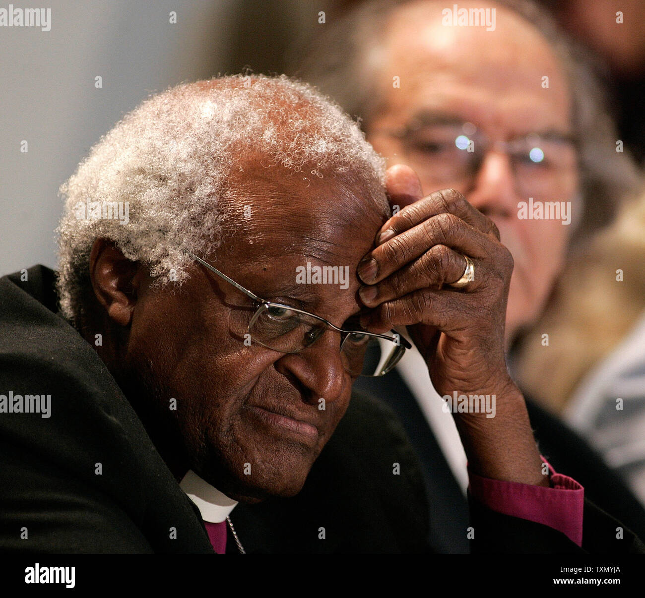 Nobel Peace Prize Laureates Bishop Desmond Tutu (L) of South Africa and ...