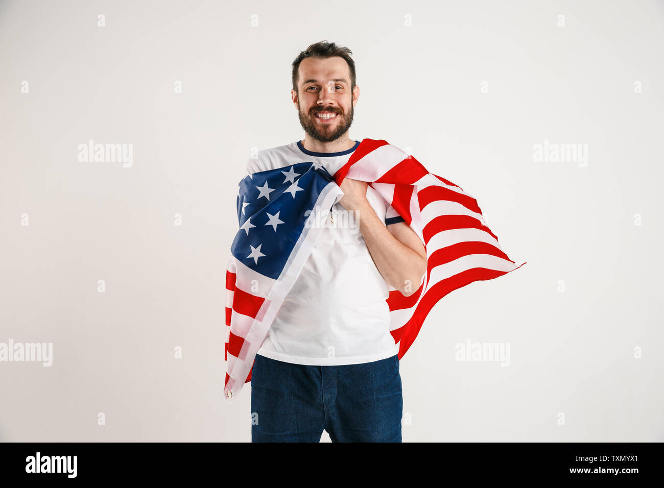 Celebrating an Independence day. Stars and Stripes. Young man with the ...