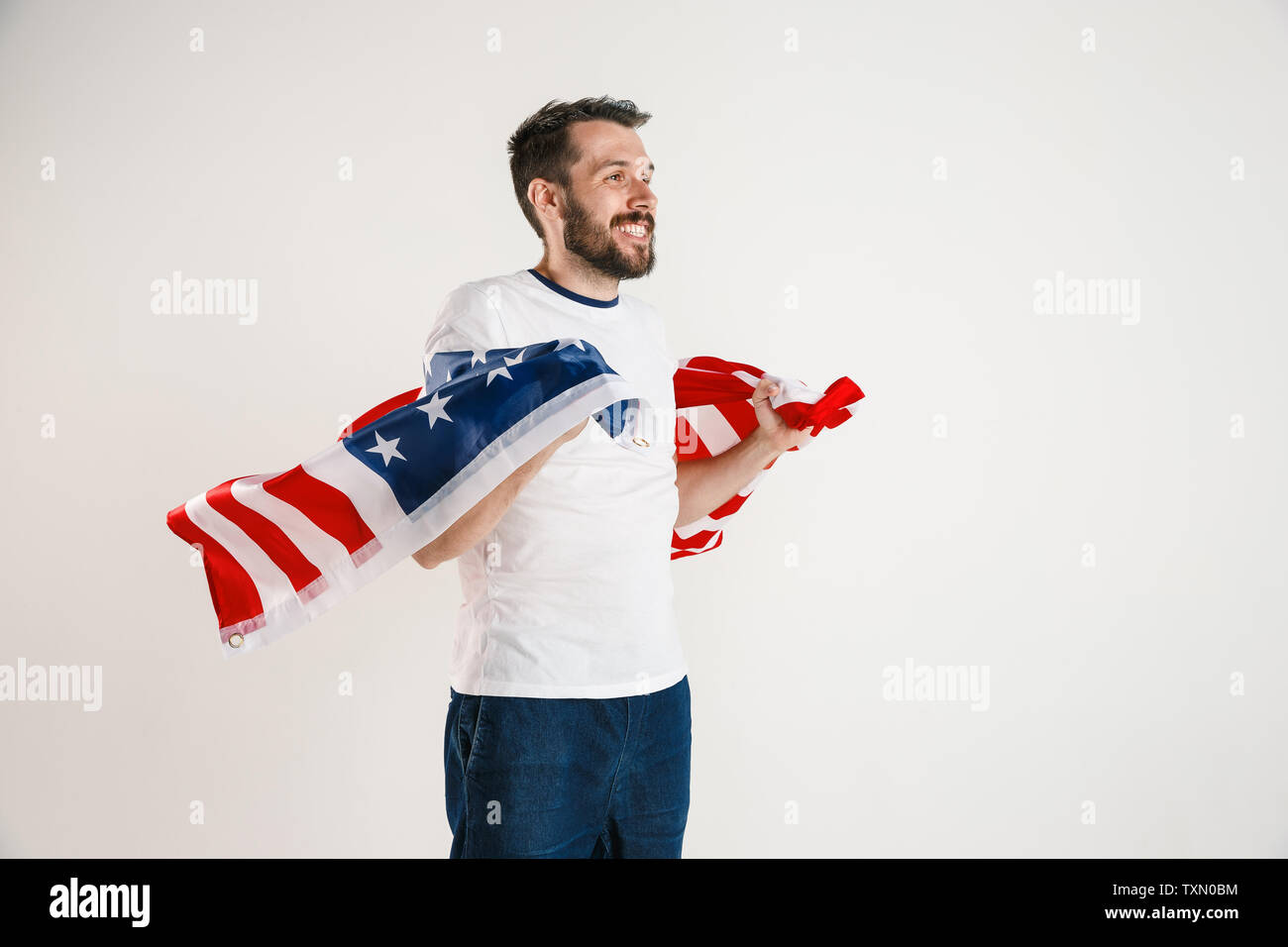 Celebrating an Independence day. Stars and Stripes. Young man with the ...