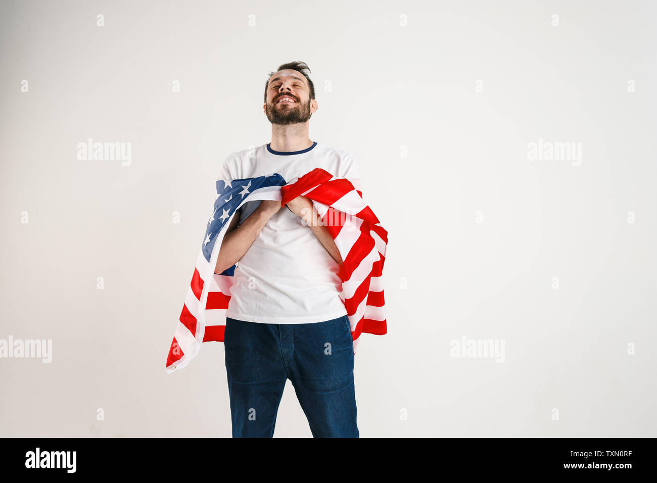 Celebrating an Independence day. Stars and Stripes. Young man with the ...