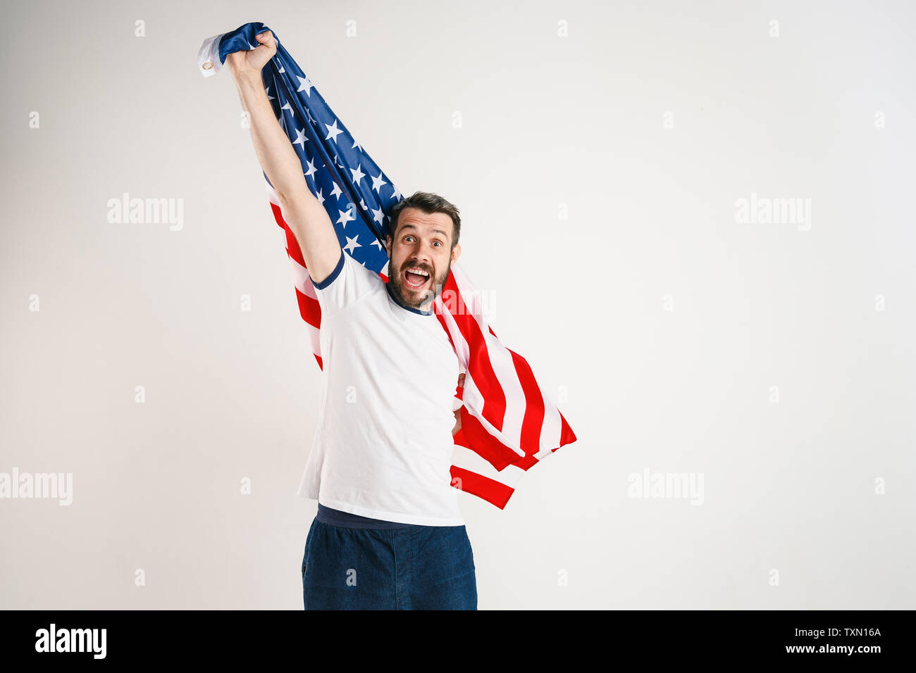 Celebrating an Independence day. Stars and Stripes. Young man with the ...