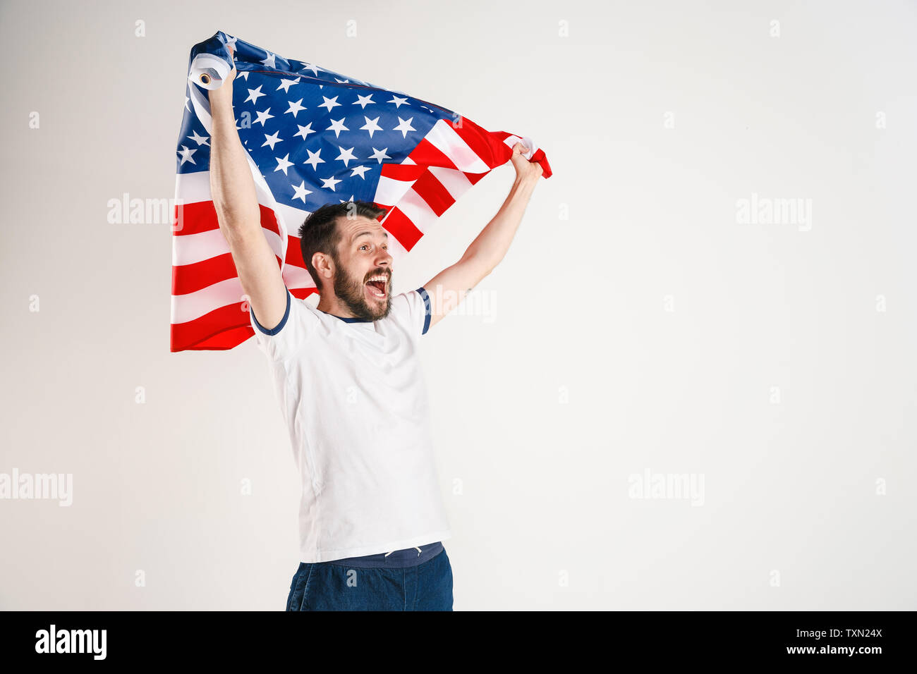 Celebrating an Independence day. Stars and Stripes. Young man with the ...