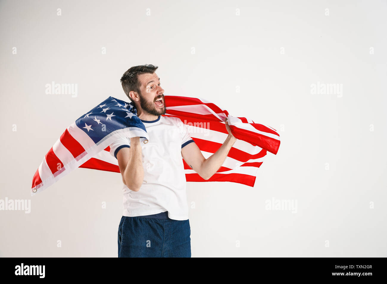 Celebrating an Independence day. Stars and Stripes. Young man with the ...