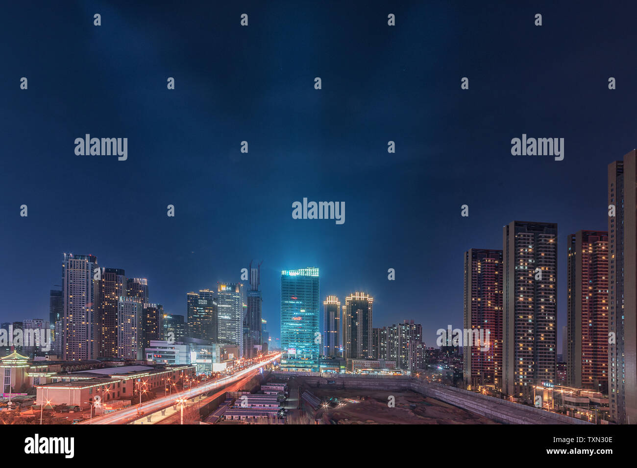 City buildings under the night sky Stock Photo - Alamy
