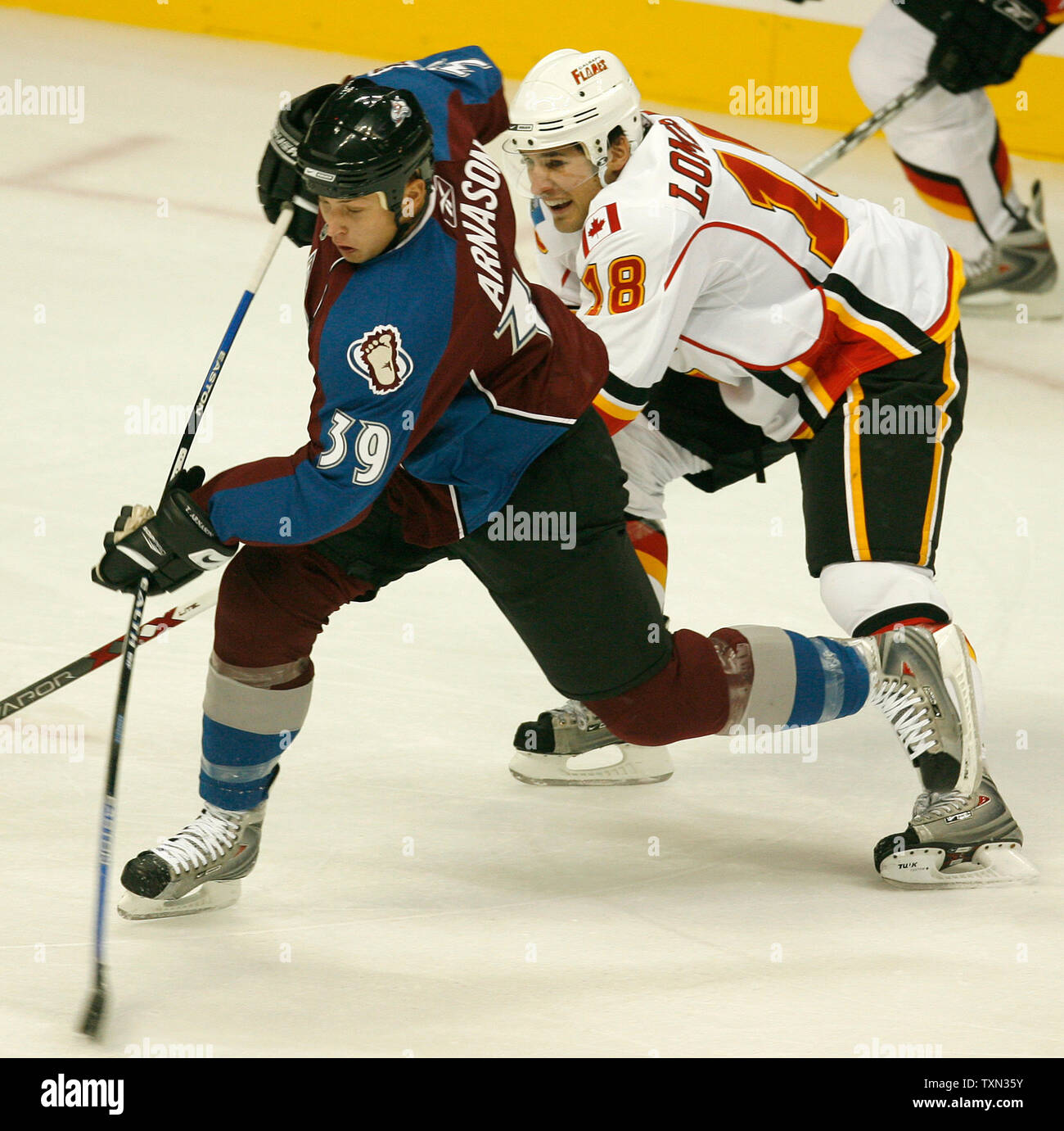 Colorado Avalanche center Tyler Arnason (L) shoots on goal defended ...