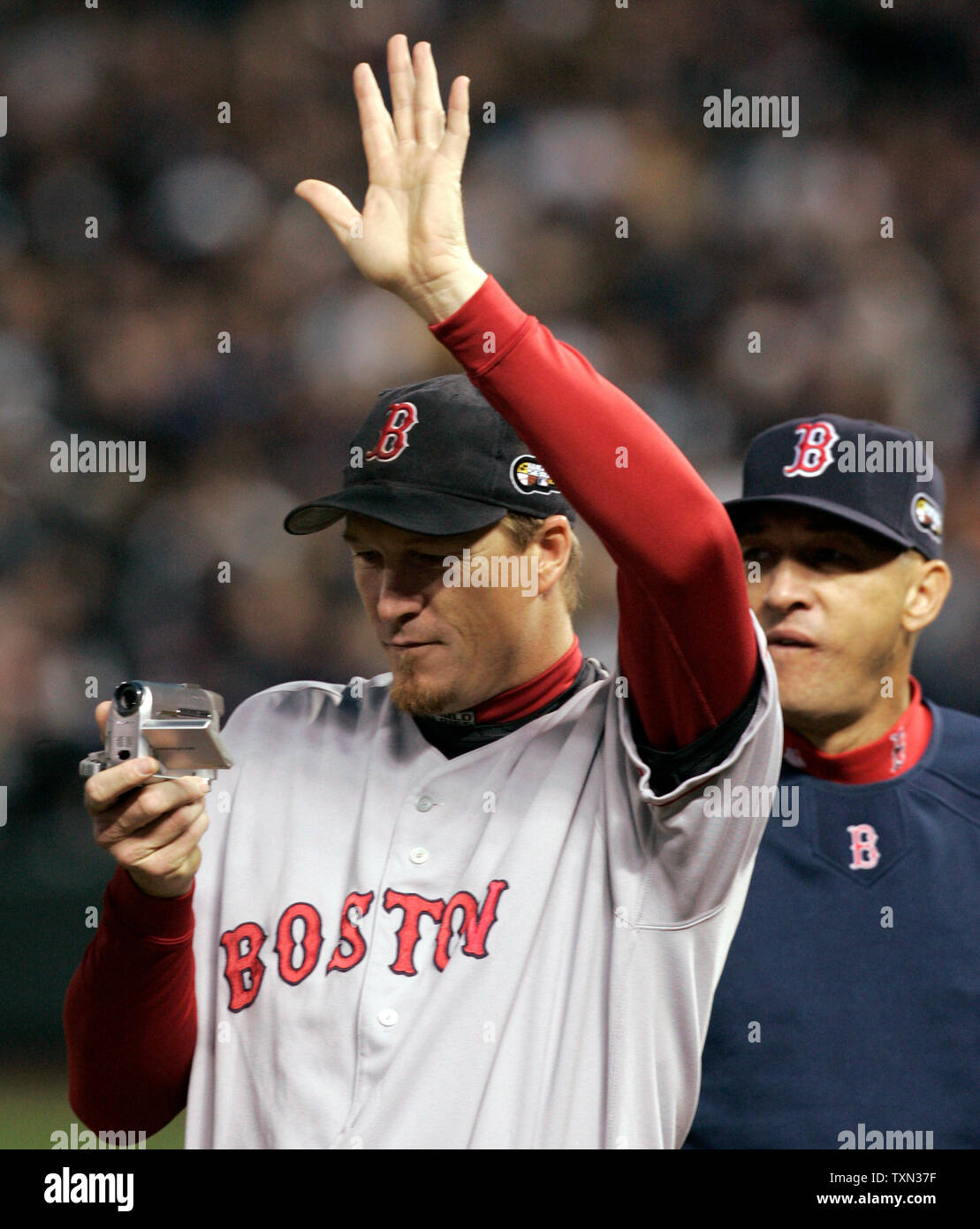 Boston Red Sox pitcher Mike Timlin waves to friends as teams are ...