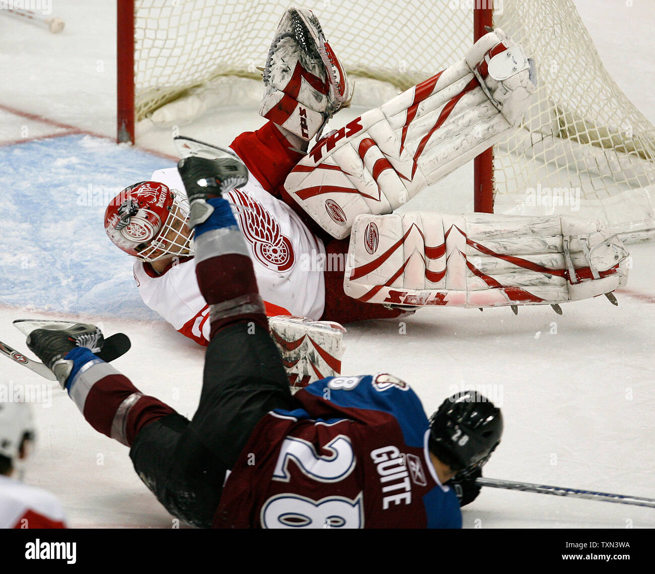 Detroit Red Wings goalie Dominik Hasek (top) of the Czech Republic ...