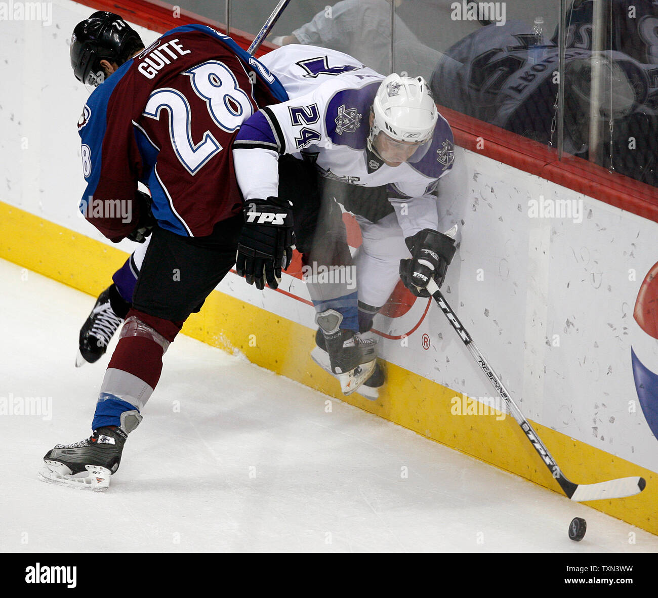 Colorado Avalanche defenseman Ben Guite checks Los Angeles Kings left ...
