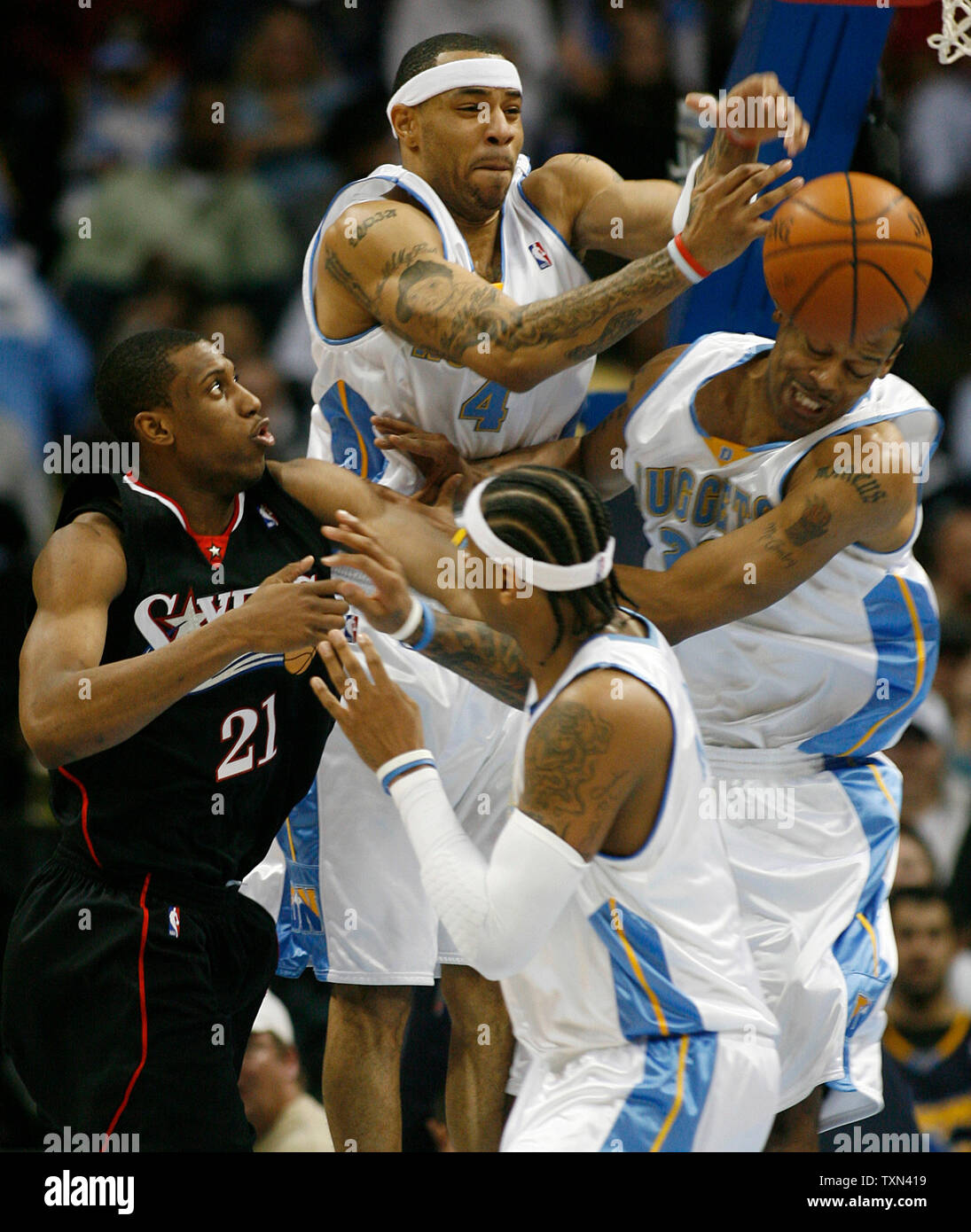 Denver Nuggets forward Kenyon Martin (top), center Marcus Camby (R ...