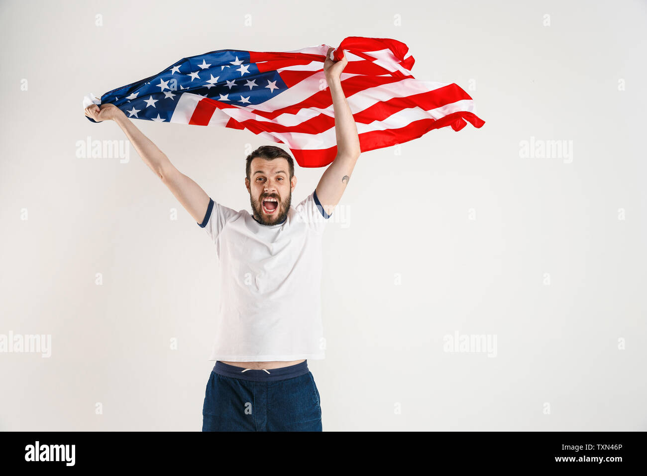 Celebrating an Independence day. Stars and Stripes. Young man with the ...