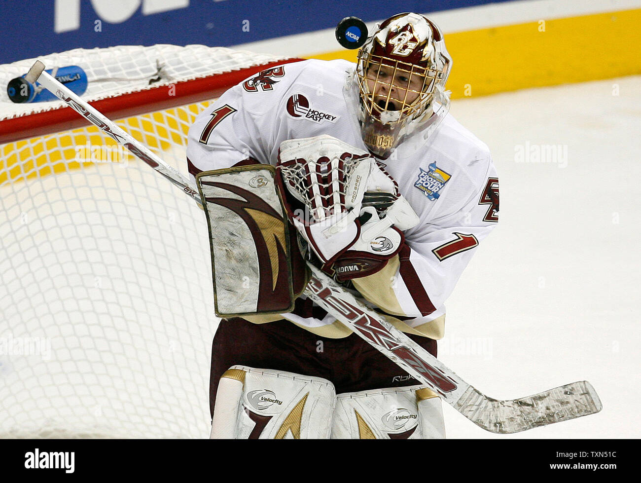 Boston College Eagles goalie John Muse makes a save against the Notre ...