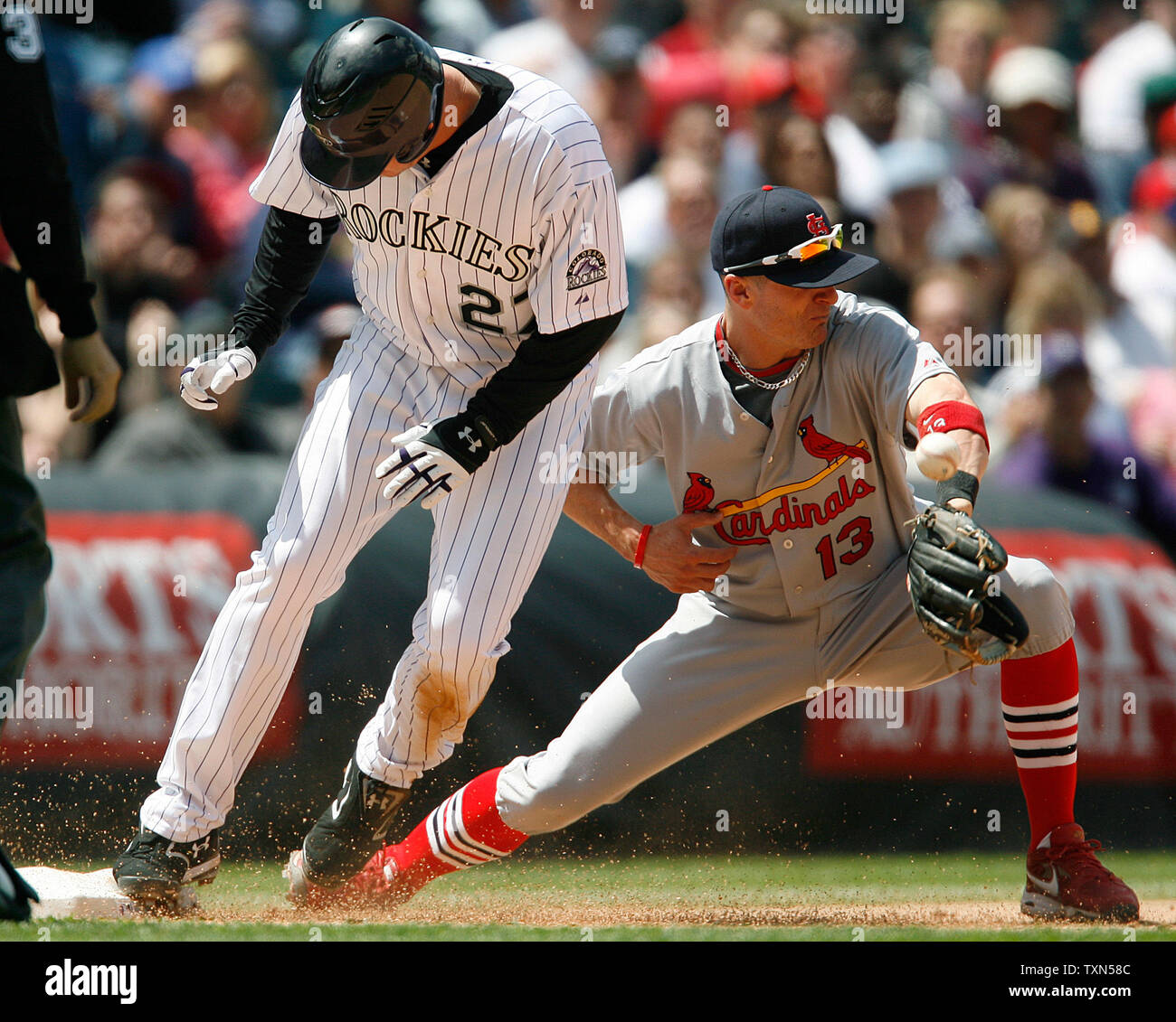 Colorado Rockies third baseman Garrett Atkins (27) triples against St ...