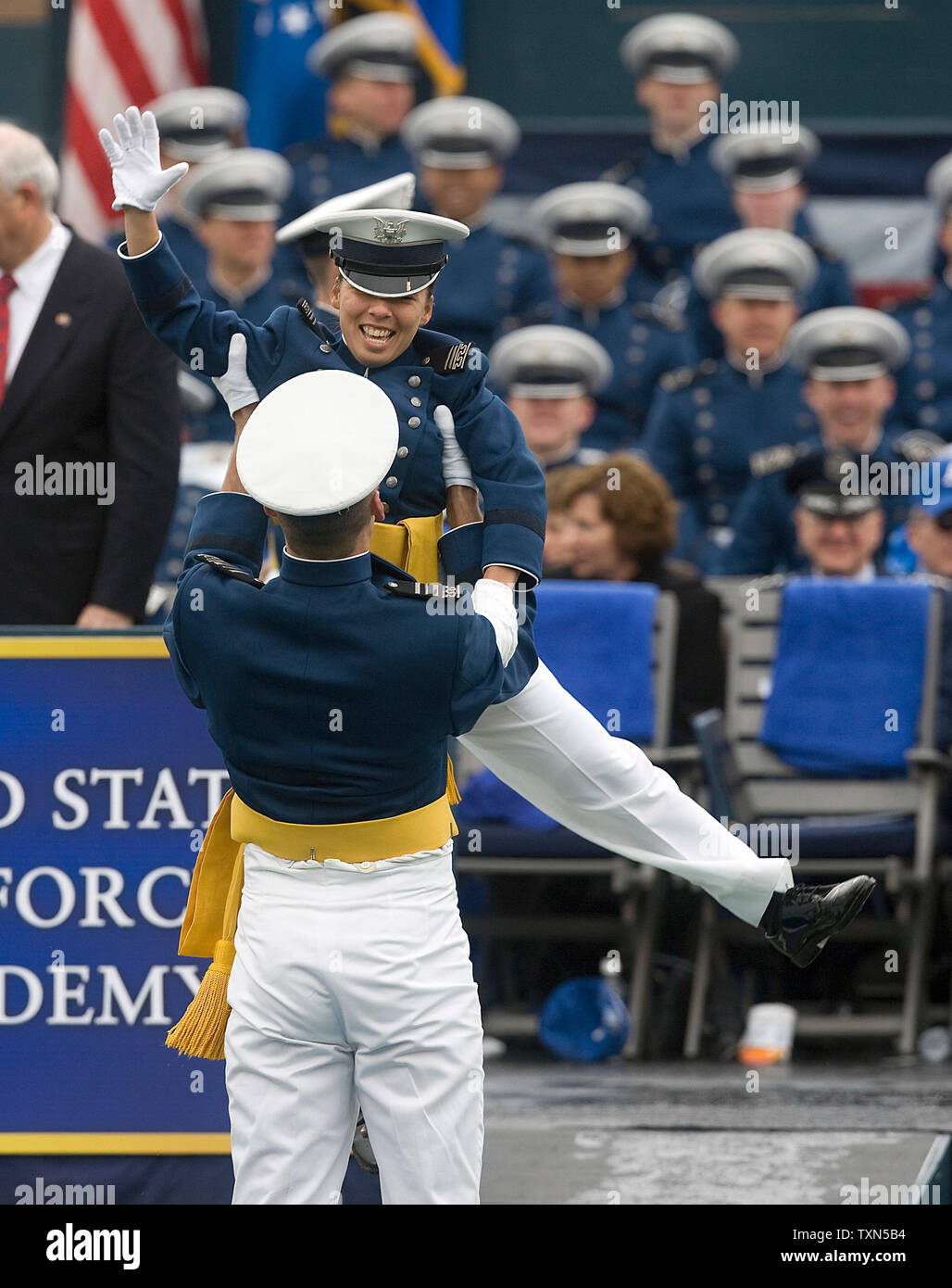 Air Force cadets celebrate after receiving their diplomas at the United ...
