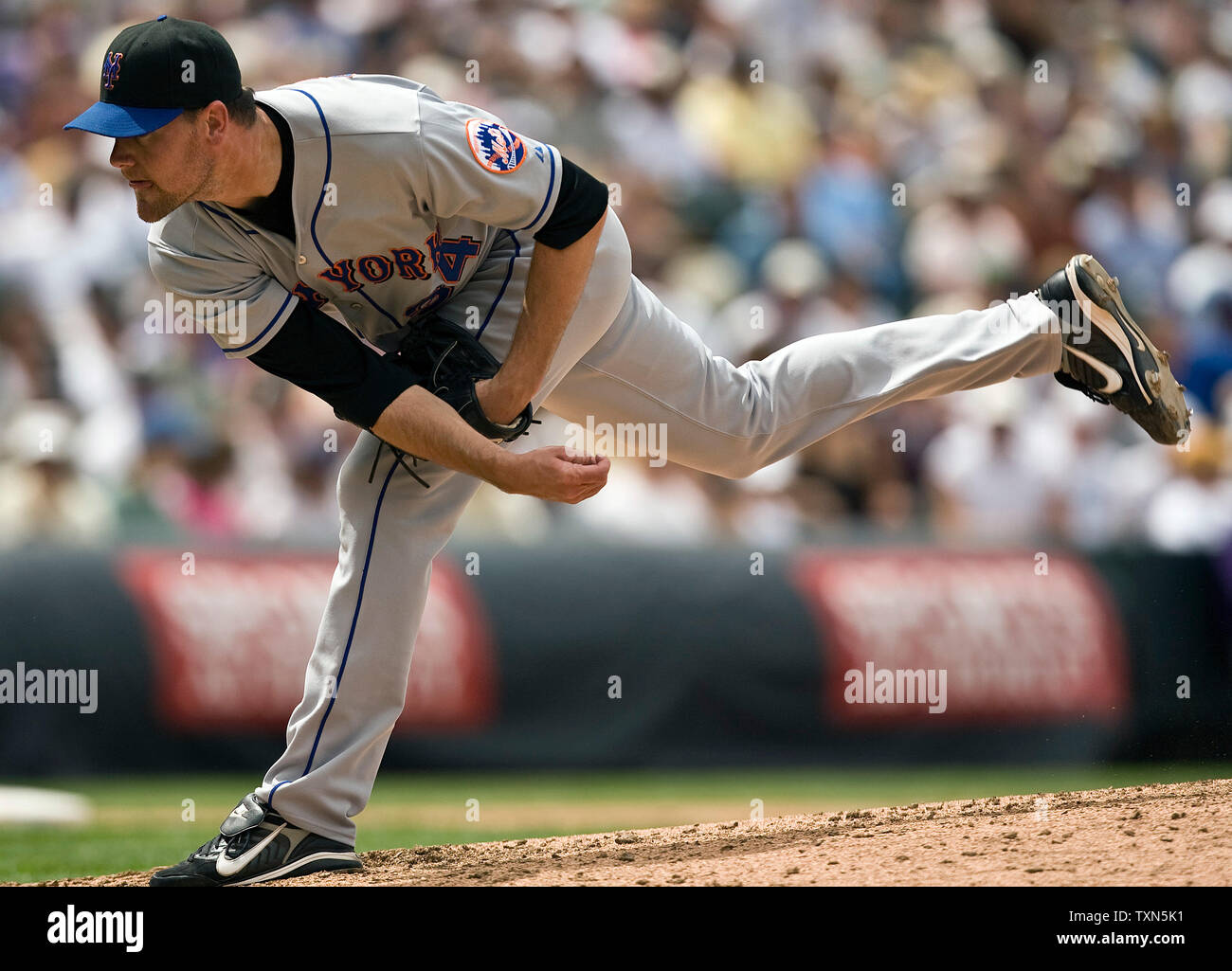 New York Mets starting pitcher Mike Pelfrey throws against the Colorado ...