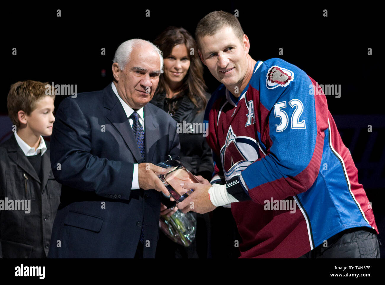 NHL Vice President of Operations Jim Gregory (L) presents Colorado ...